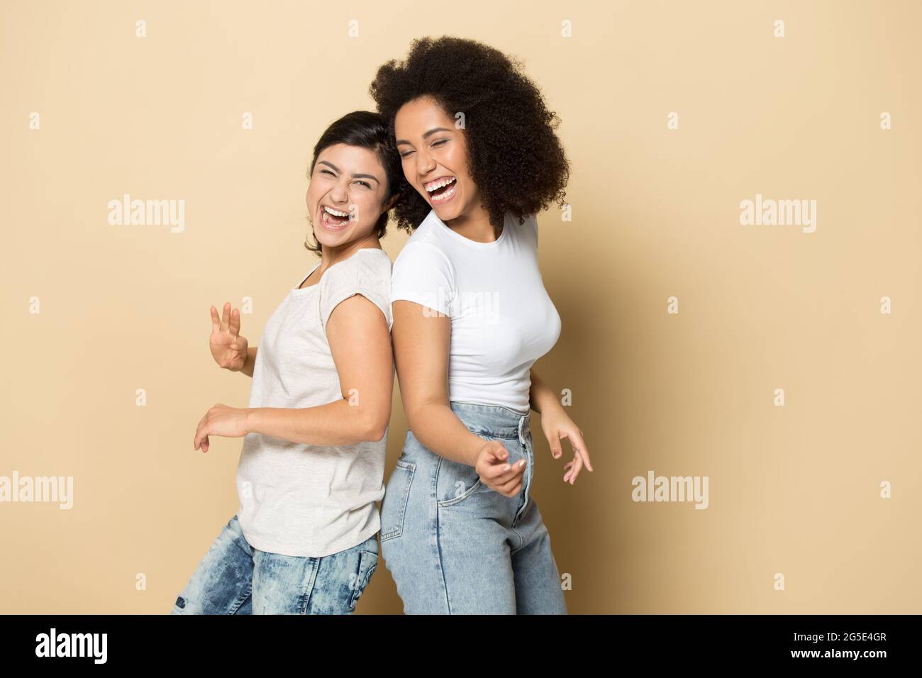 Excited diverse girlfriends have fun dancing together Stock Photo - Alamy