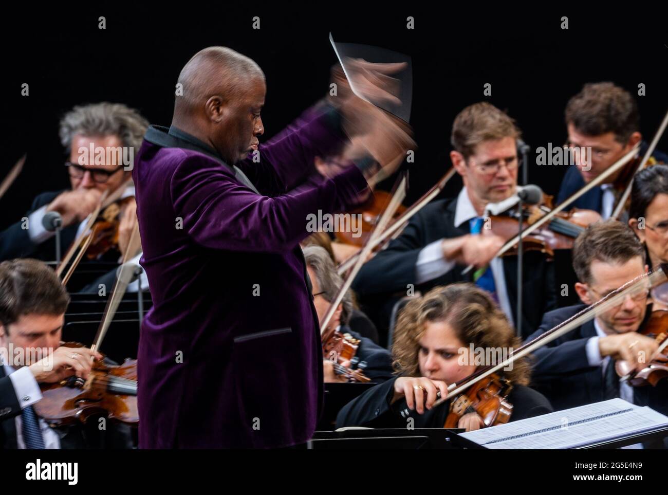 Berlin, Germany. 26th June, 2021. Wayne Marshall conducts at a concert ...