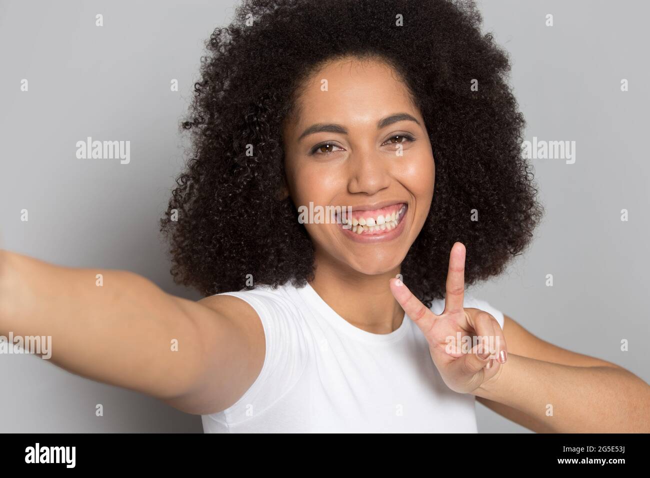Smiling African American woman take self-portrait picture Stock Photo ...