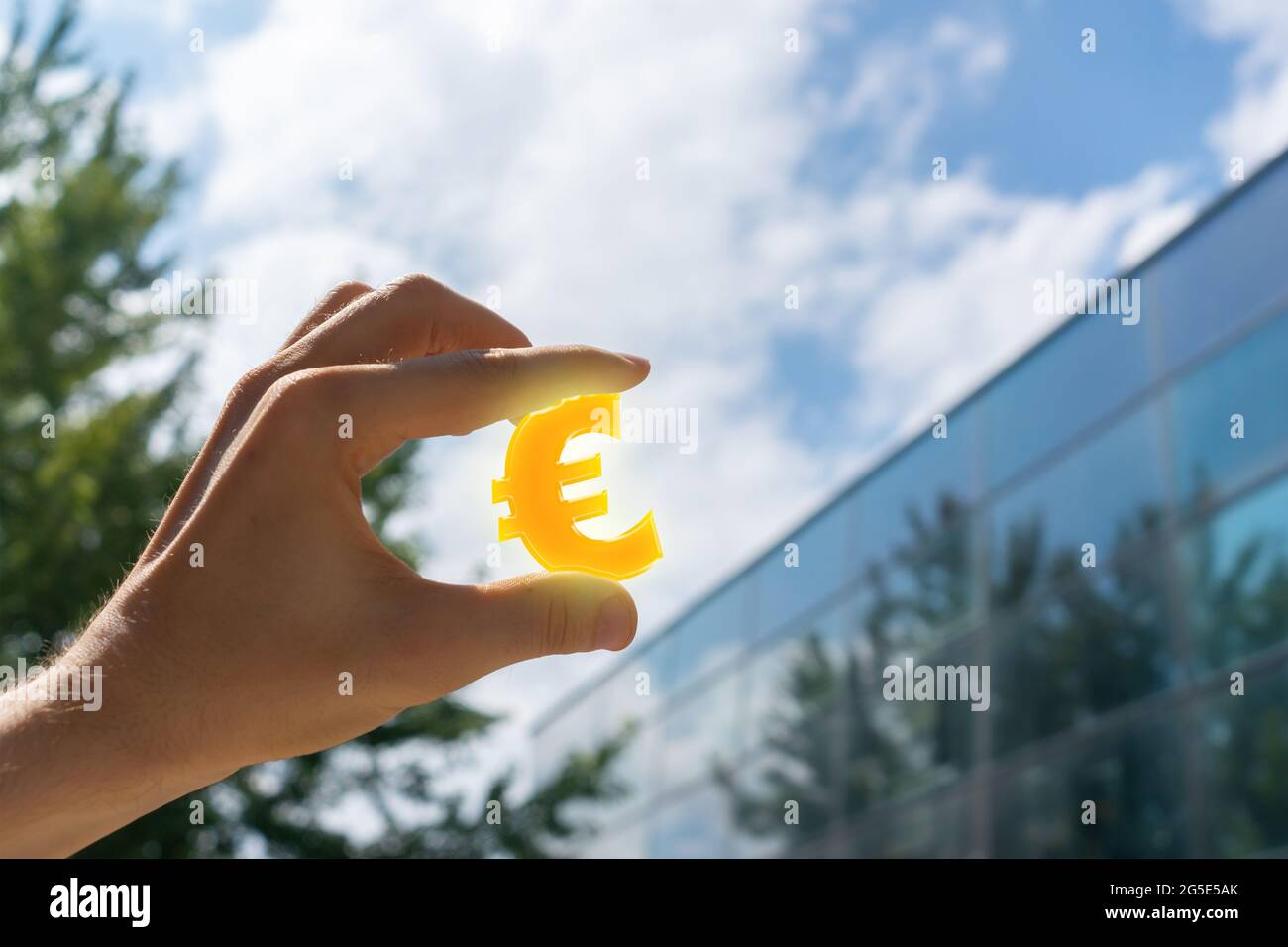 hand holding a euro sign, money increase symbol concept, financial ...