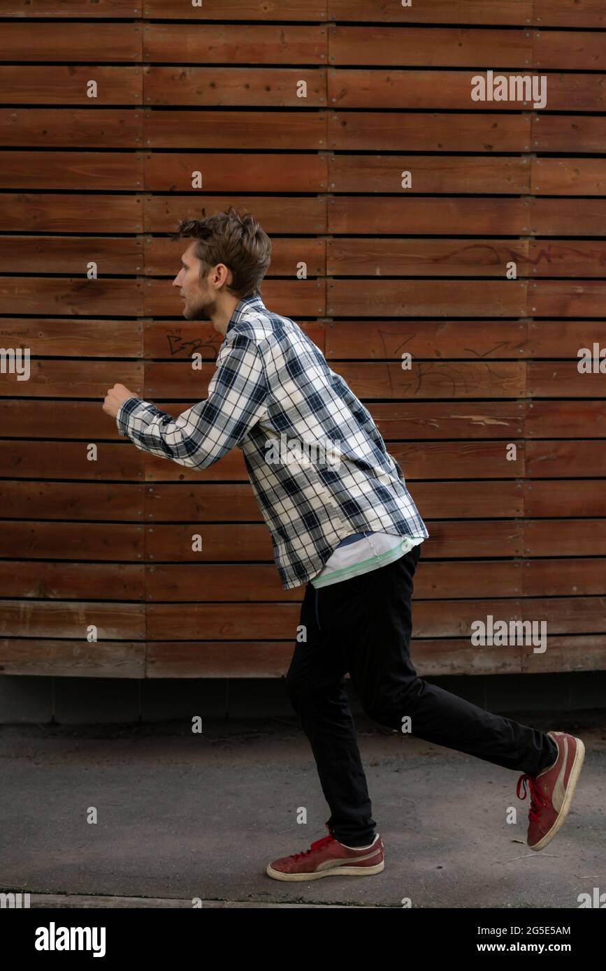 young man hurry up, running fast on the meeting Stock Photo - Alamy
