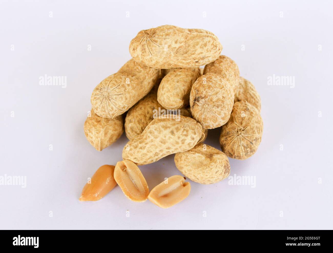 Peanuts stacked separately on white background . Separated seeds in ...