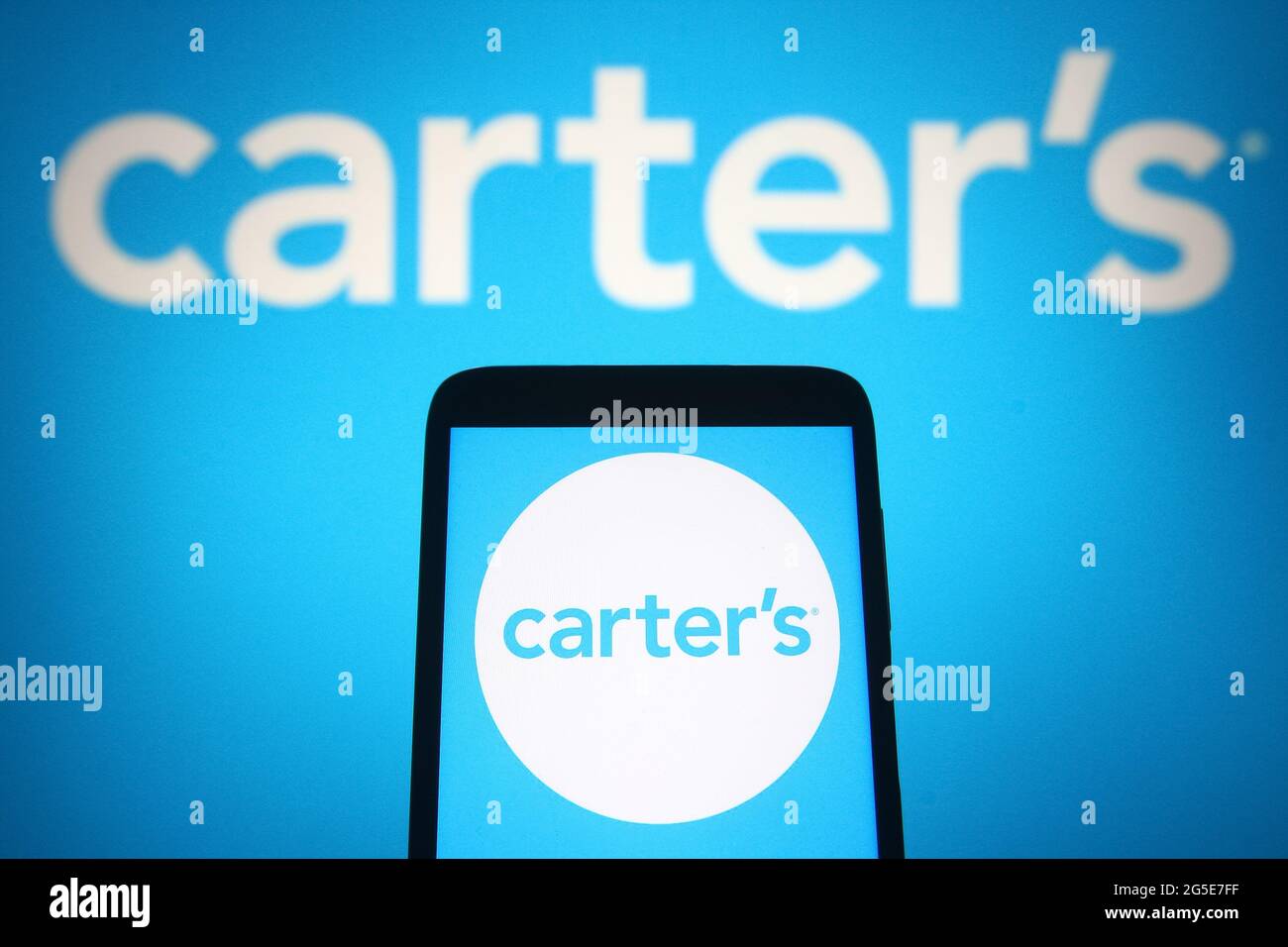 In this photo illustration a Carter's logo is seen on a smartphone and ...