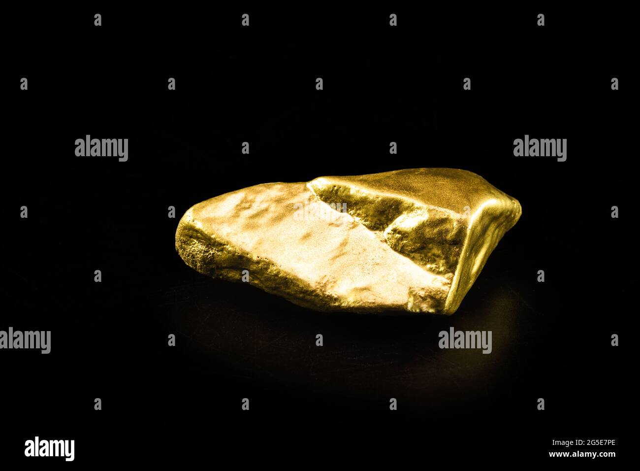 gold stone on isolated black background, rare and precious mineral ...