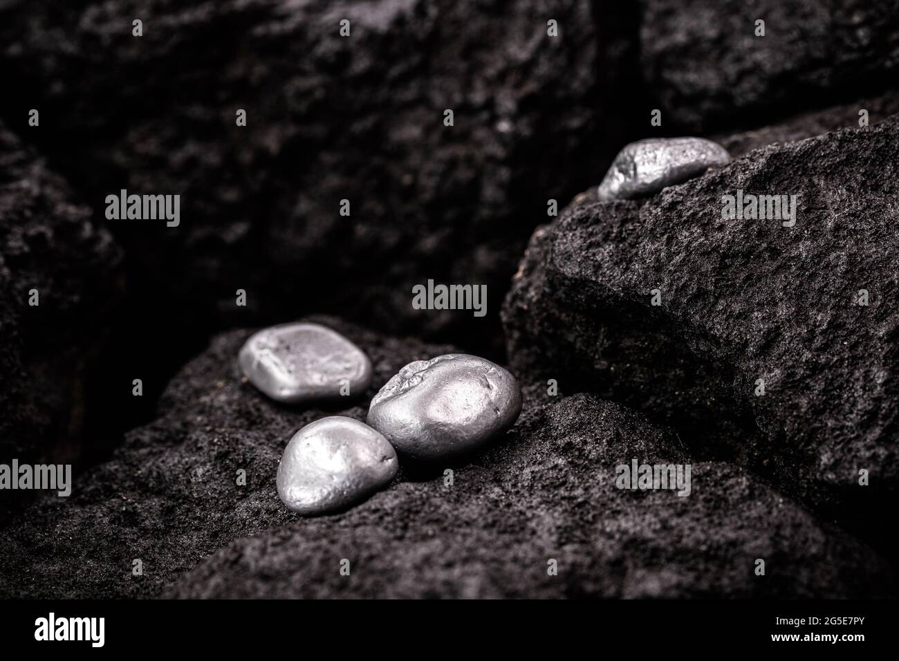 silver stones in mine, mineral extraction concept Stock Photo - Alamy