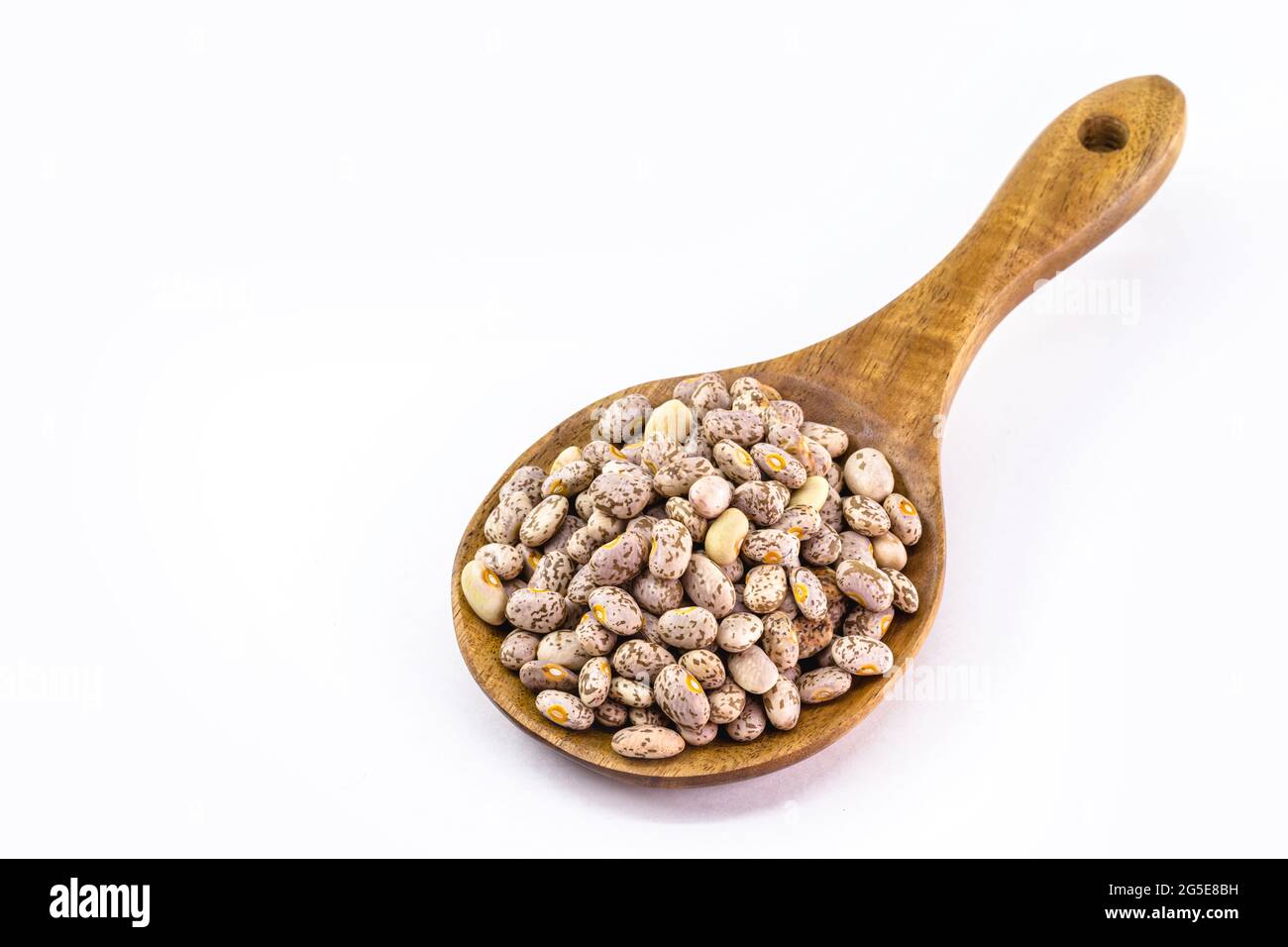 rustic wooden ladle with brazilian beans, wooden spoon, isolated white ...