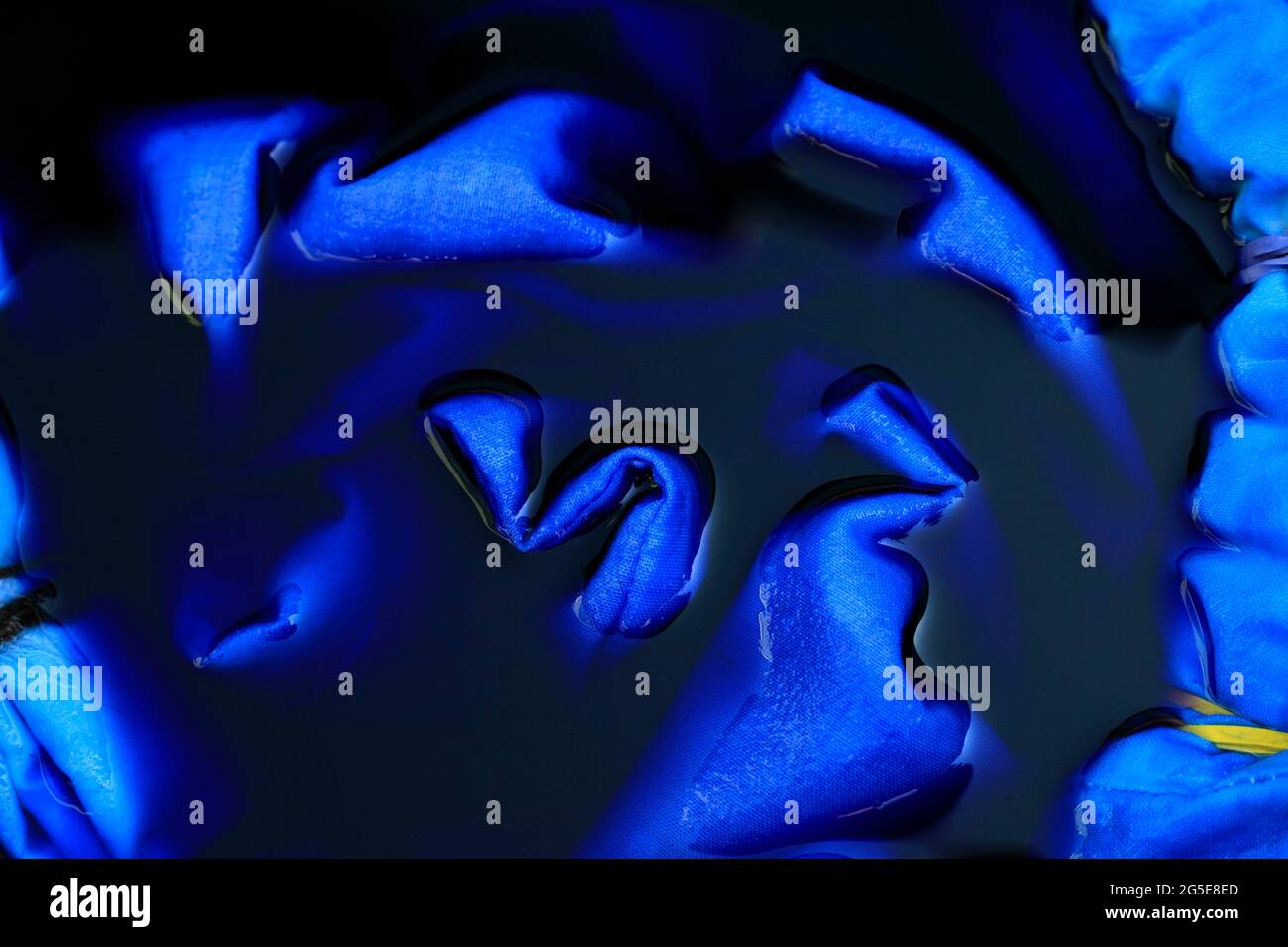 Dark blue fabric dye hi-res stock photography and images - Alamy