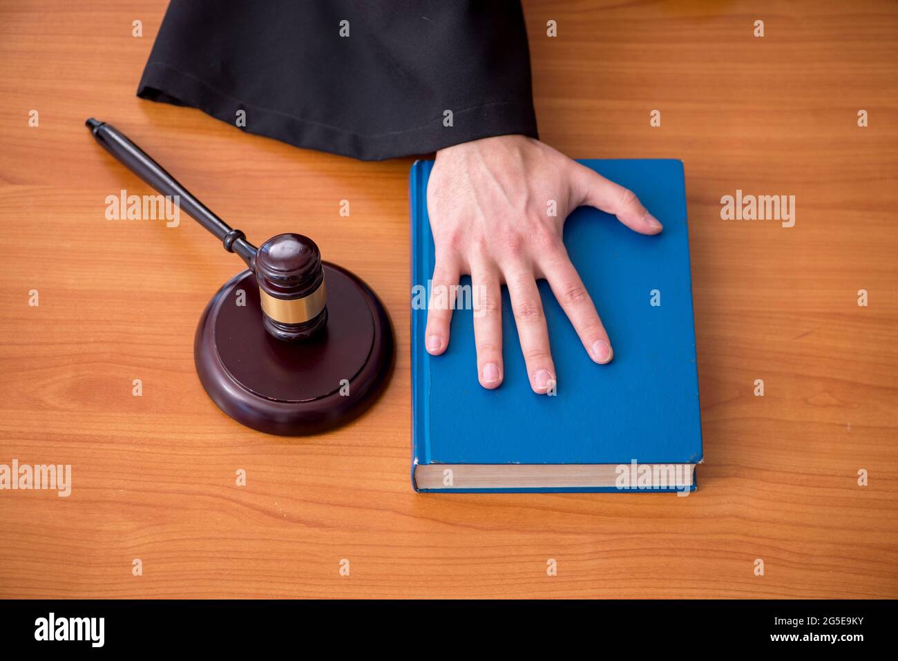 Young judge working in the courtroom Stock Photo - Alamy