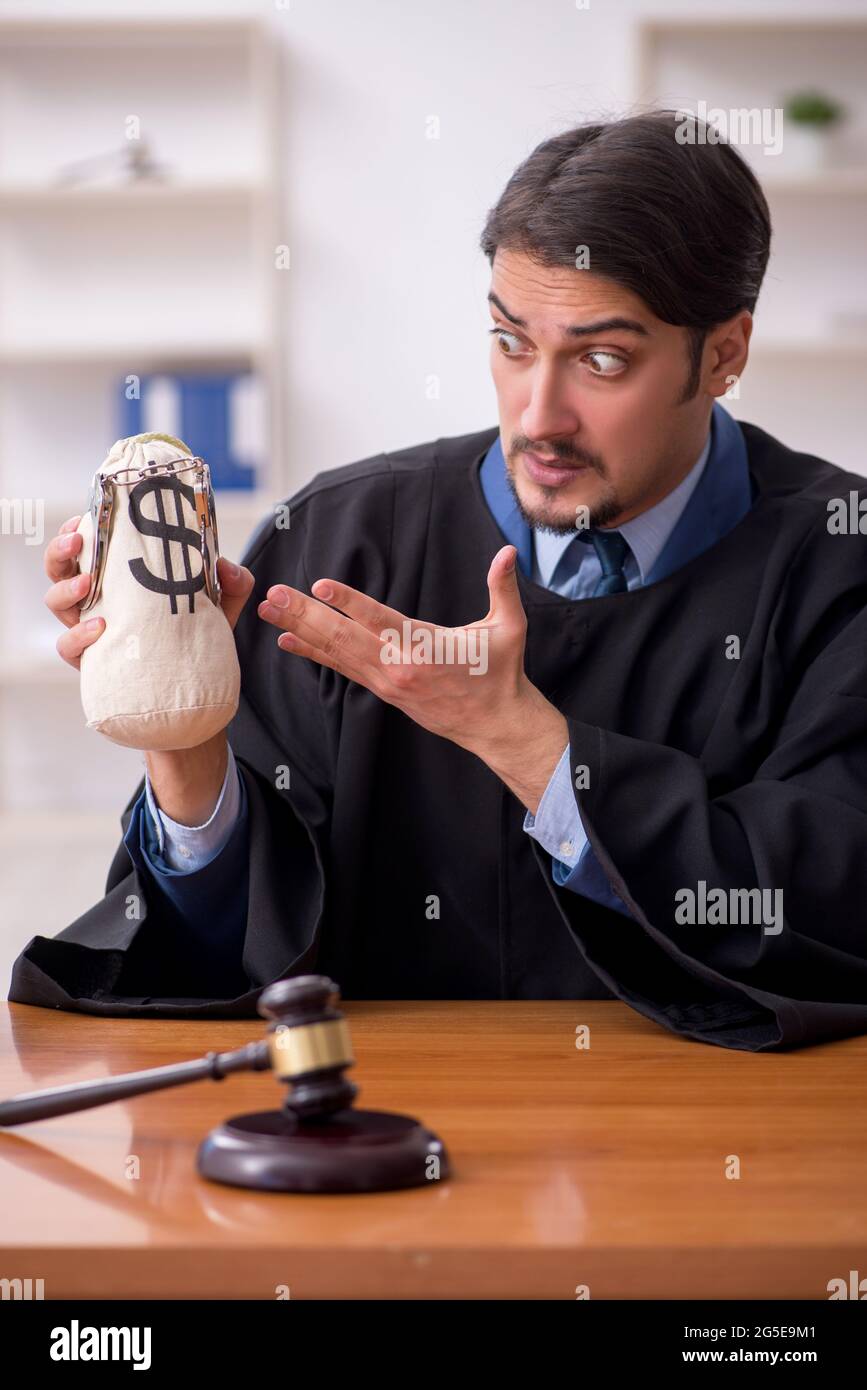 Young judge working in the courtroom Stock Photo - Alamy