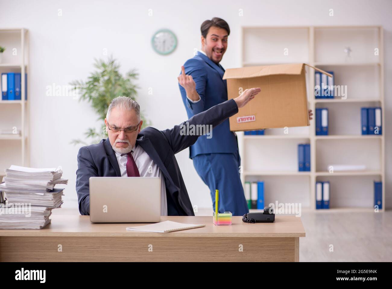 Two employees in dismissal concept Stock Photo - Alamy