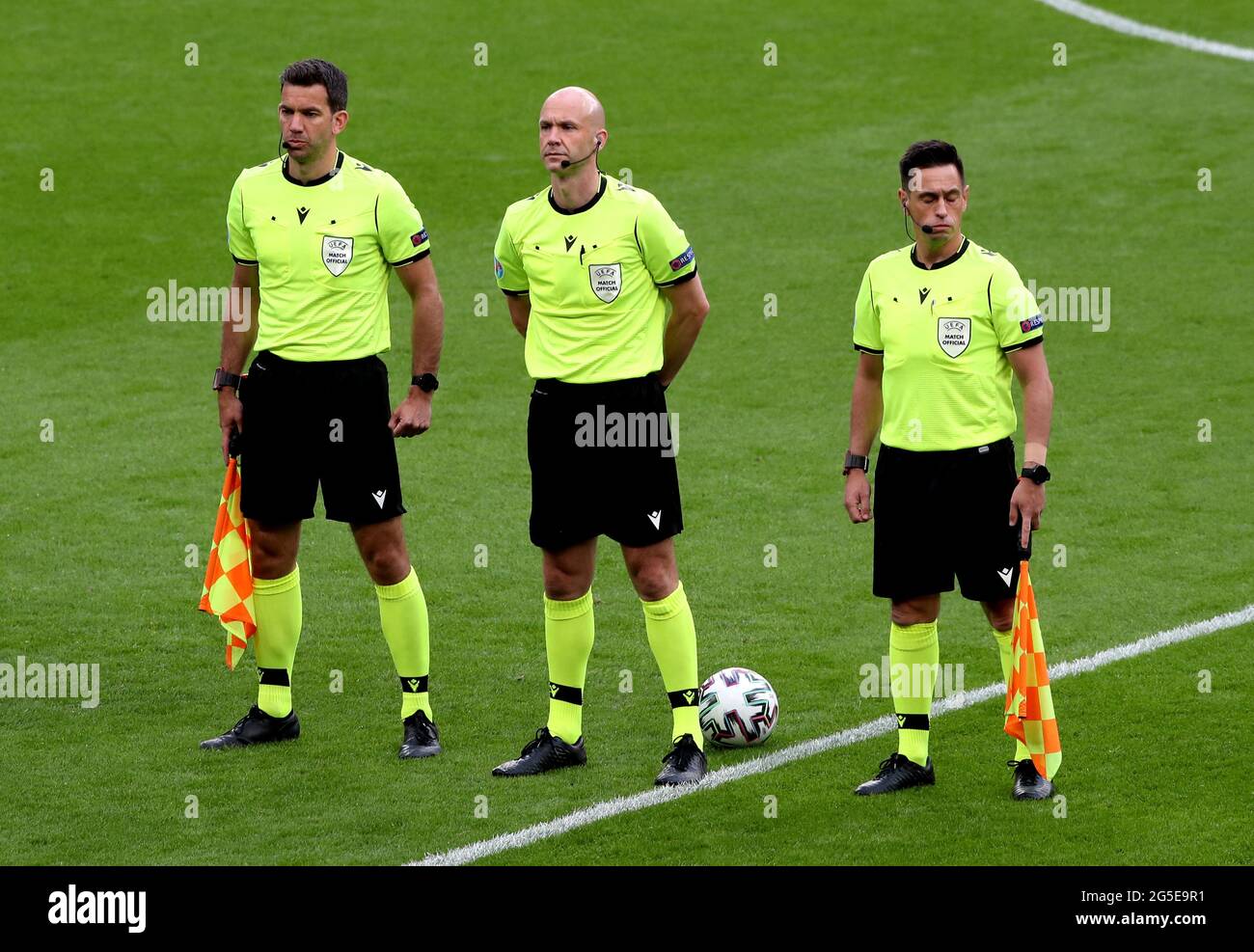 Referee Anthony Taylor (centre) and the fourth officials line up on the ...