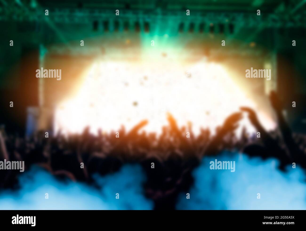 Blurred concert crowd shot, people and a stage are visible Stock Photo ...