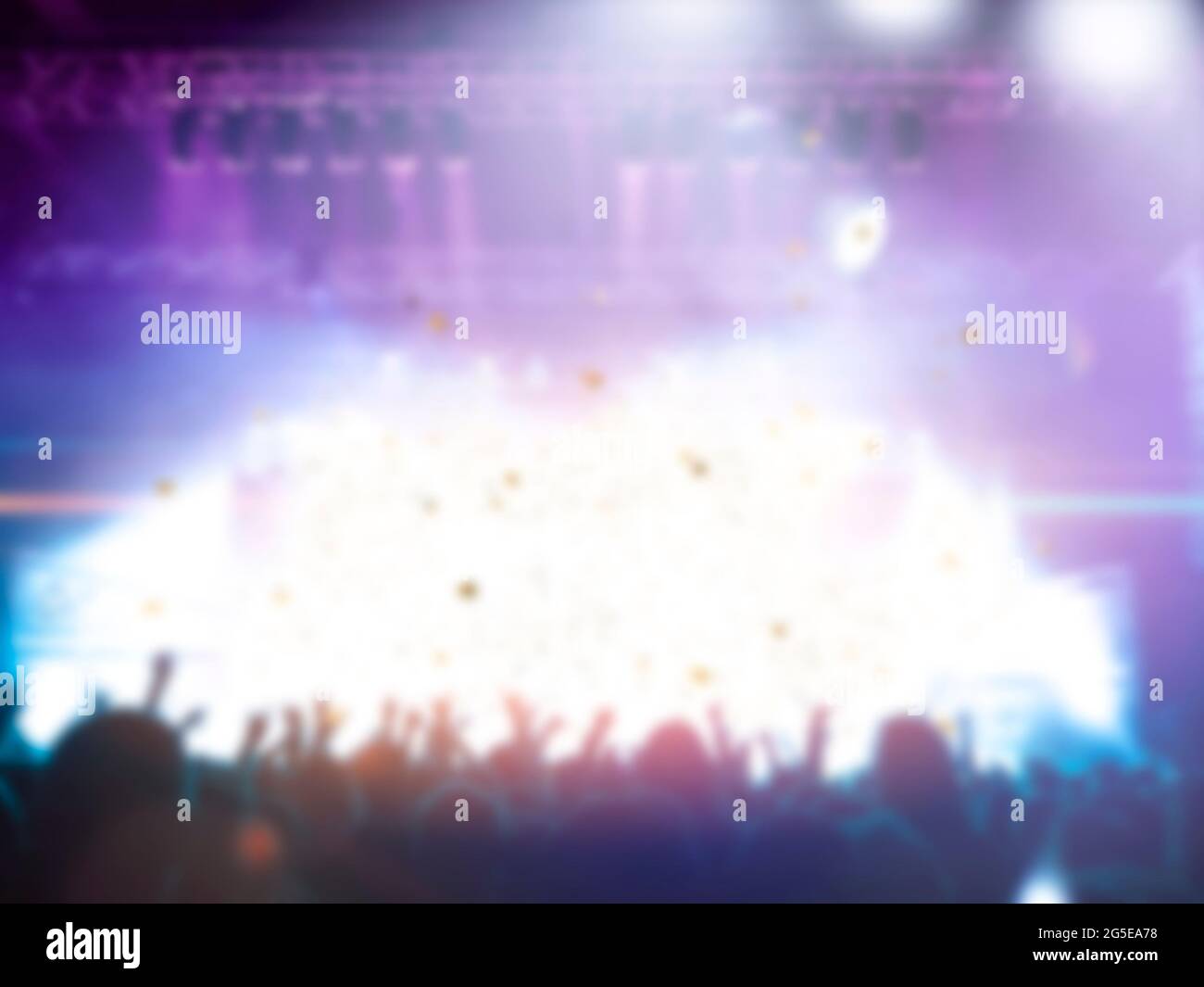 Blurred concert crowd shot, people and a stage are visible Stock Photo ...