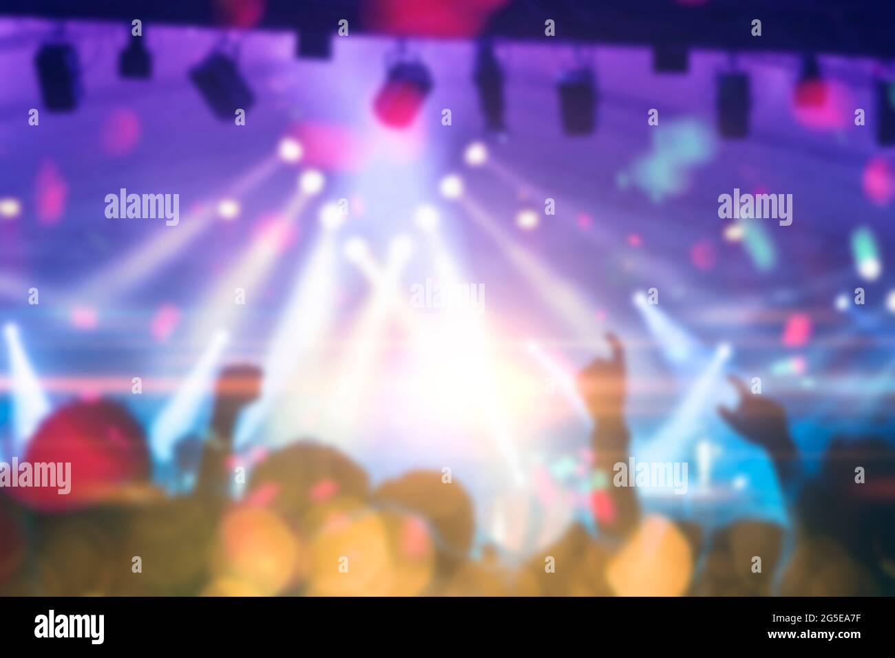 Blurred concert crowd shot, people and a stage are visible Stock Photo ...
