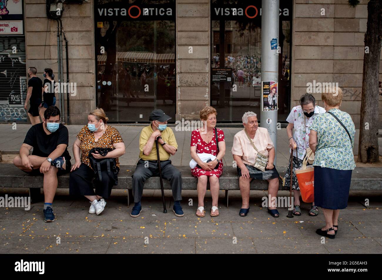 A group of people spend the afternoon in the center of Barcelona. New ...