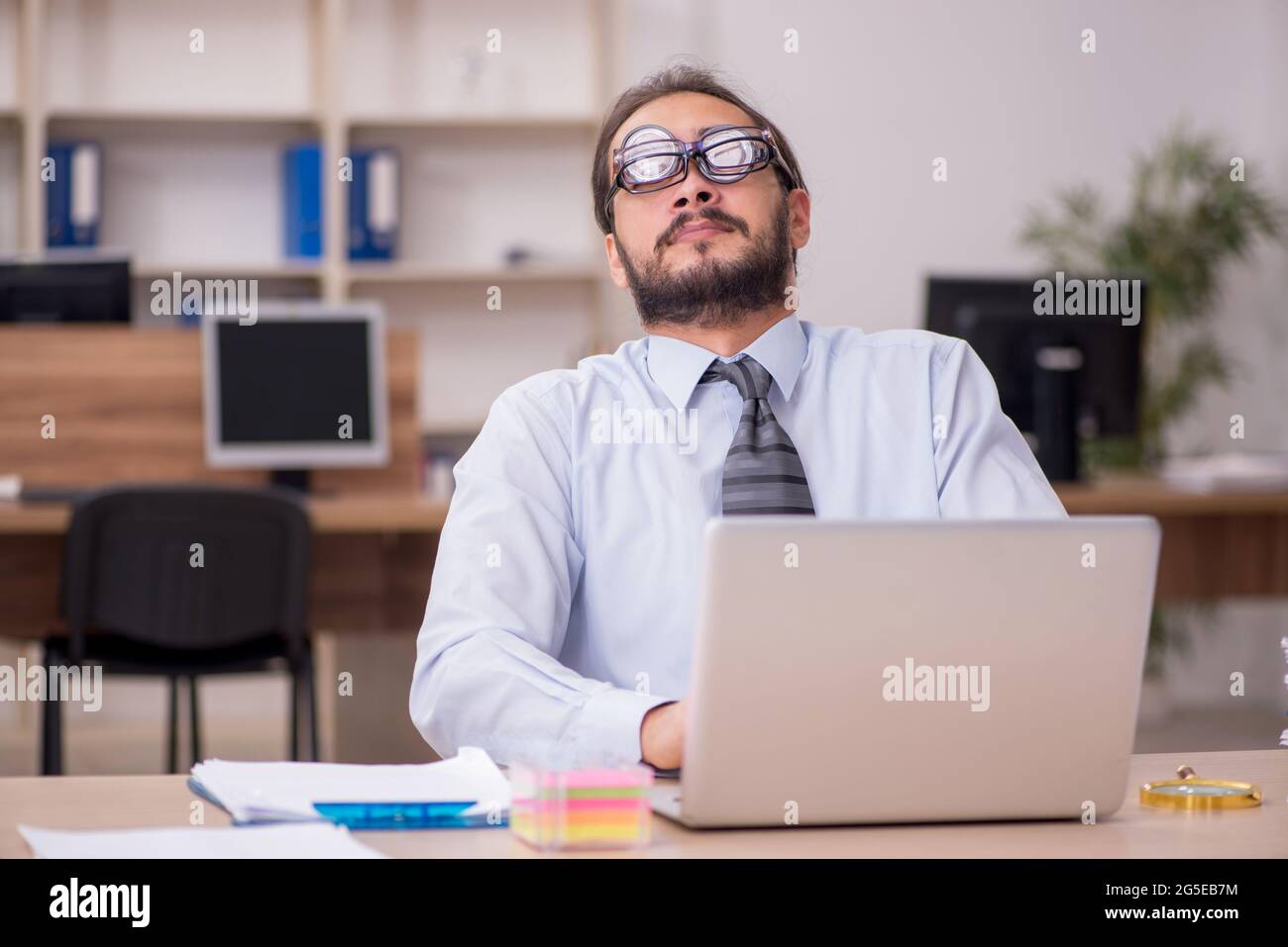Young funny employee working at workplace Stock Photo - Alamy