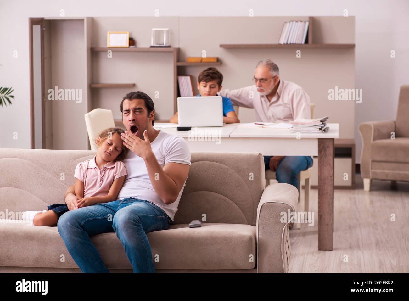 Three generations at home in early development concept Stock Photo - Alamy