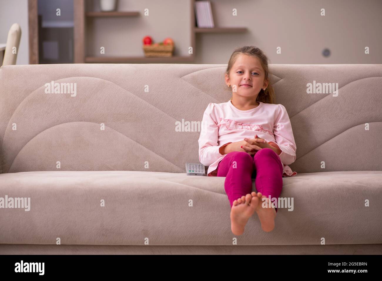 Little girl staying alone at home Stock Photo - Alamy