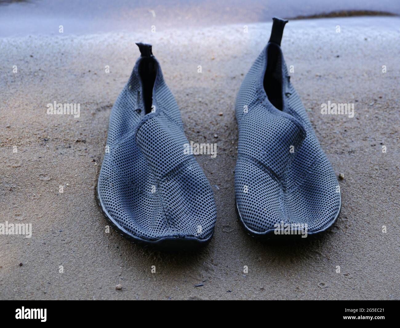 swimming slippers on the sand close-up Stock Photo - Alamy