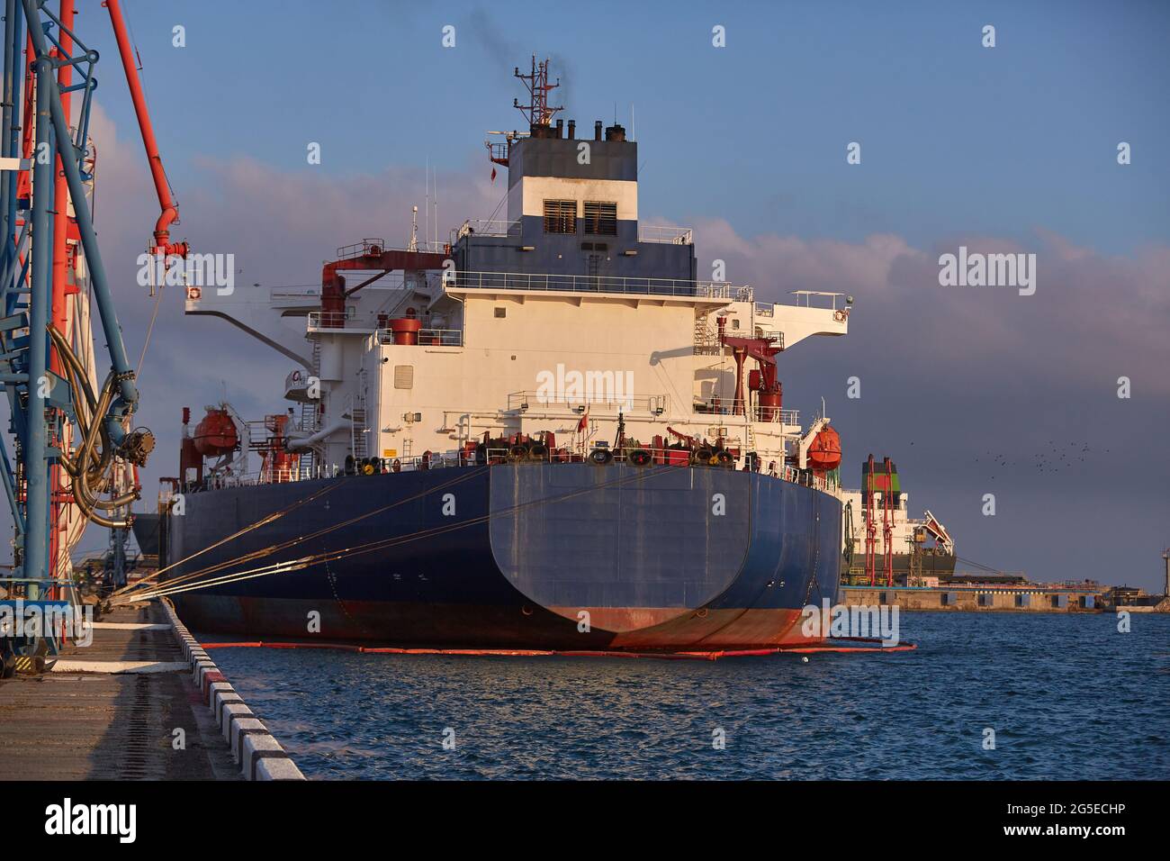 Oil tanker at the port terminal. Tanker in port at oil terminal Stock ...