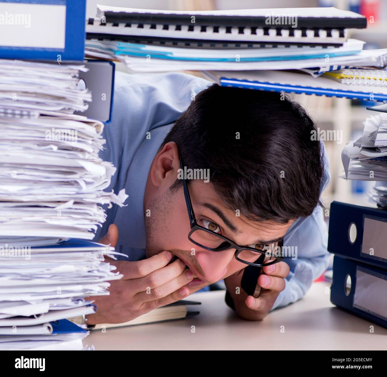 The extremely busy businessman working in office Stock Photo - Alamy