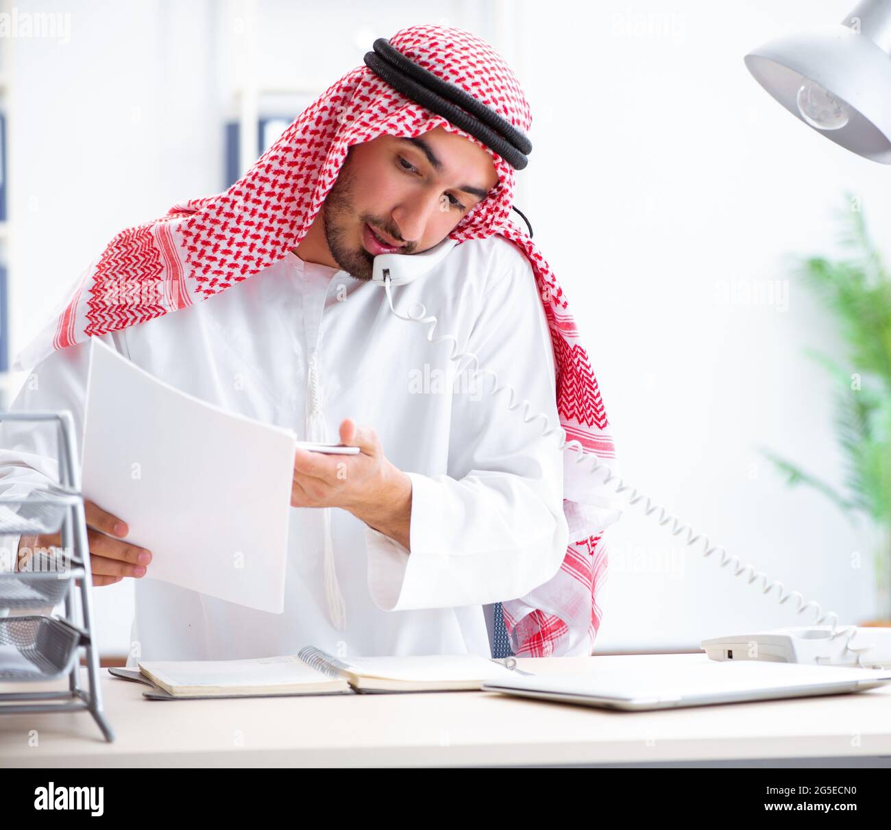 The arab businessman working in the office Stock Photo - Alamy