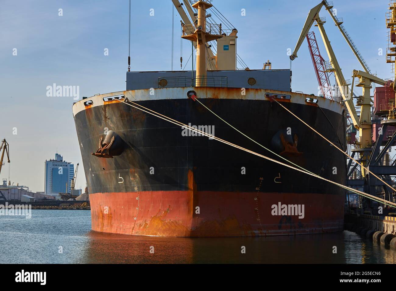 Loading cast iron ingots on ship bulk. Loading metal on ship ...