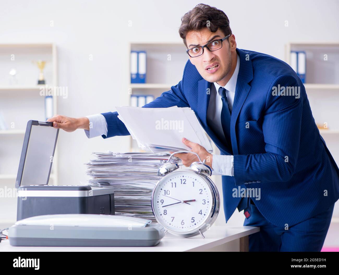 The businessman making copies in copying machine Stock Photo - Alamy