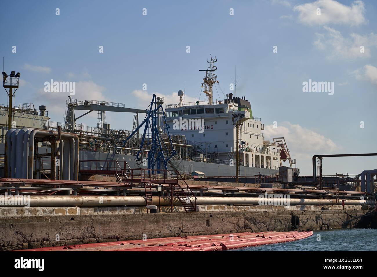 merchant vessel is gas carrier at port log terminal. The tanker at the ...