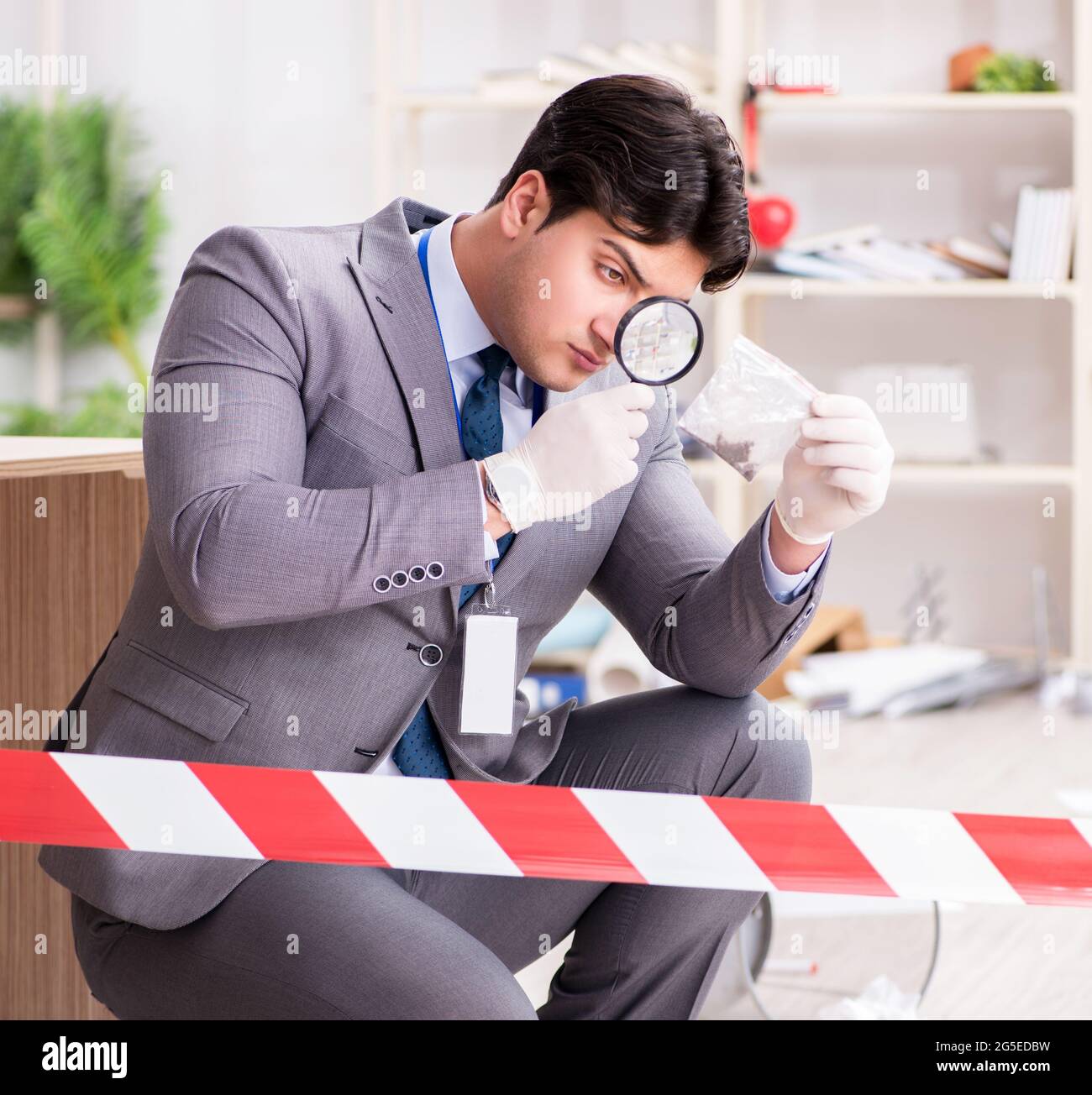 The young man during crime investigation in office Stock Photo - Alamy
