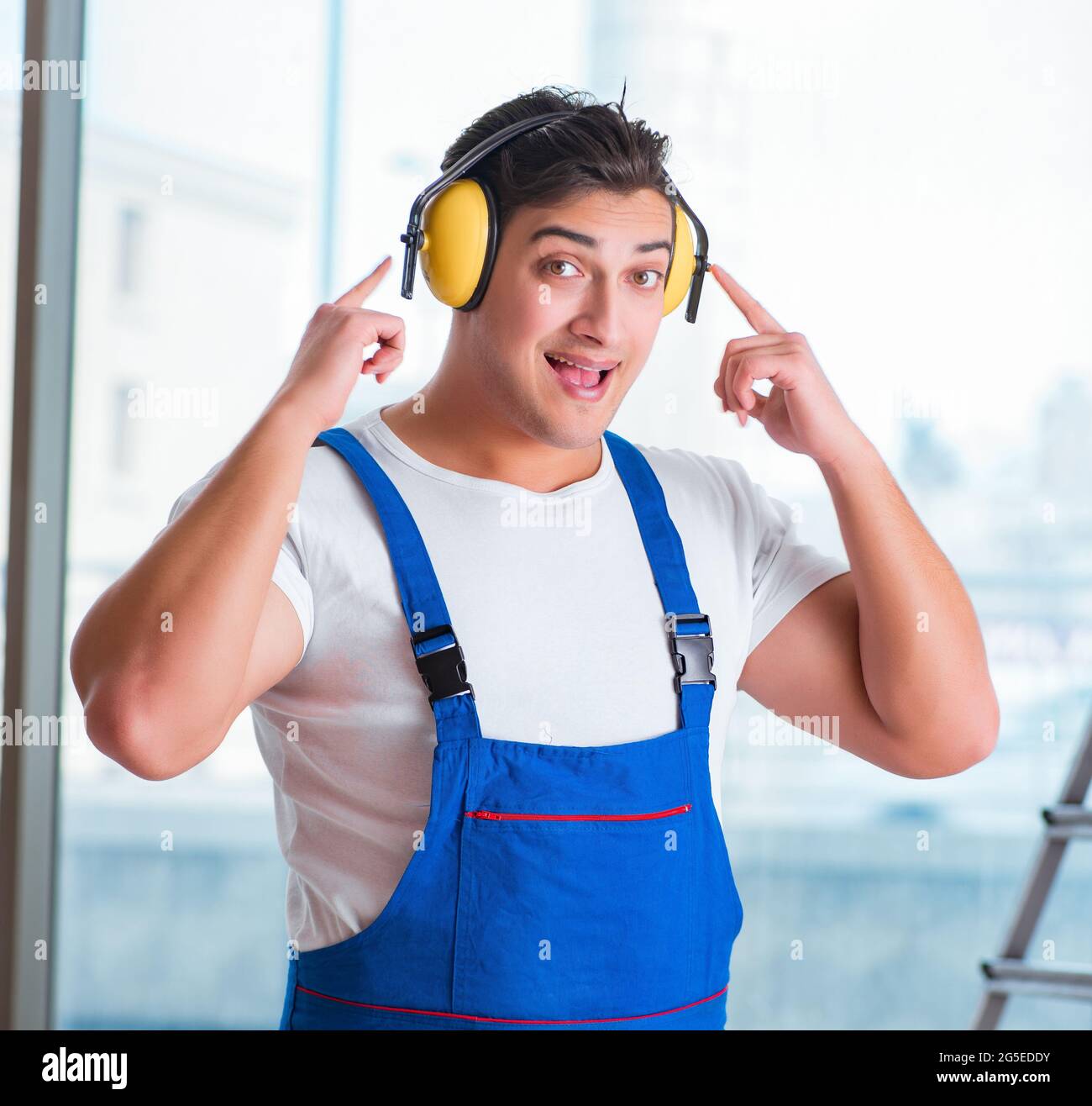 The worker with noise cancelling headphones Stock Photo - Alamy