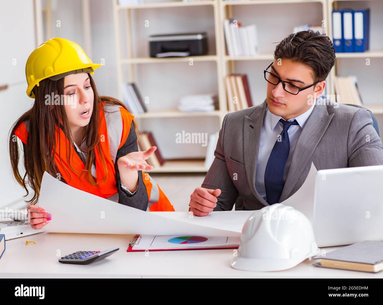 Reviewing architectural drawings hi-res stock photography and images ...