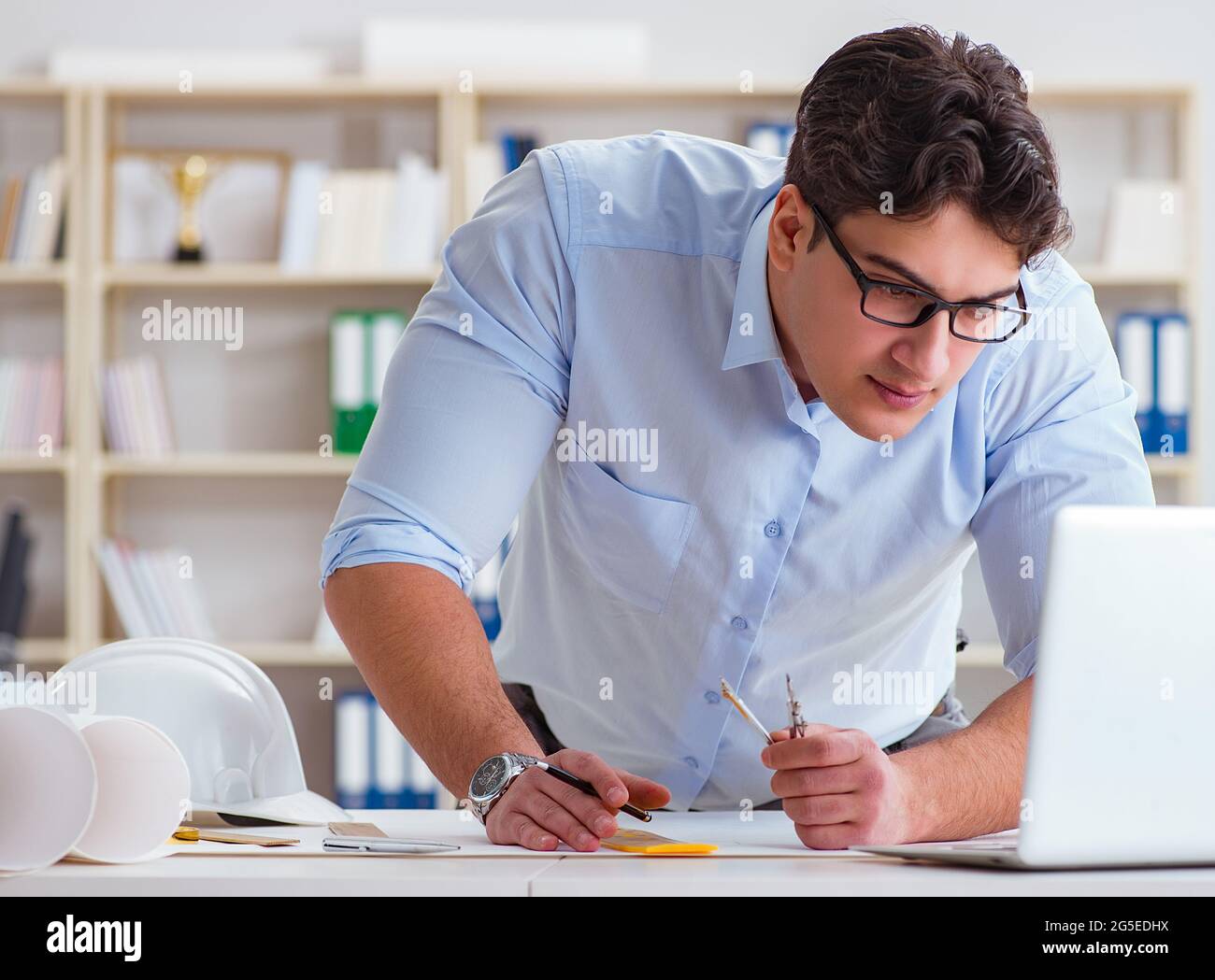 The male engineer working on drawings and blueprints Stock Photo - Alamy