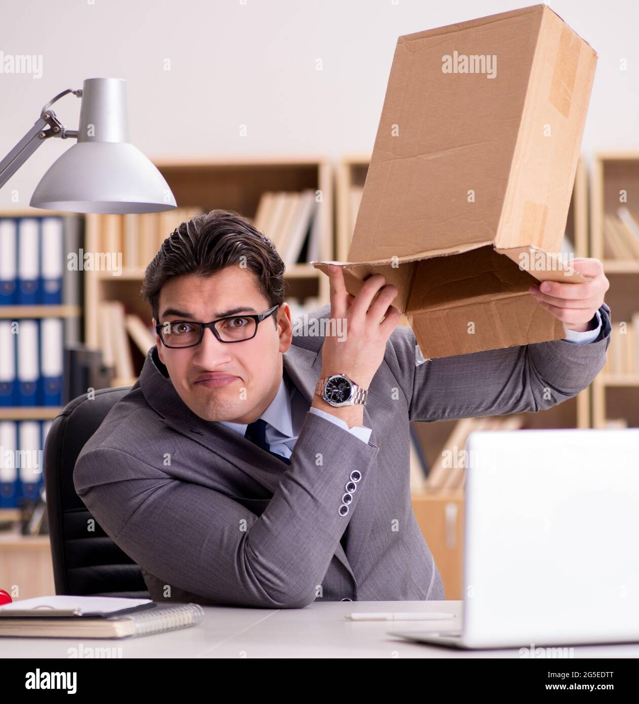 Businessman opening package in office hi-res stock photography and ...