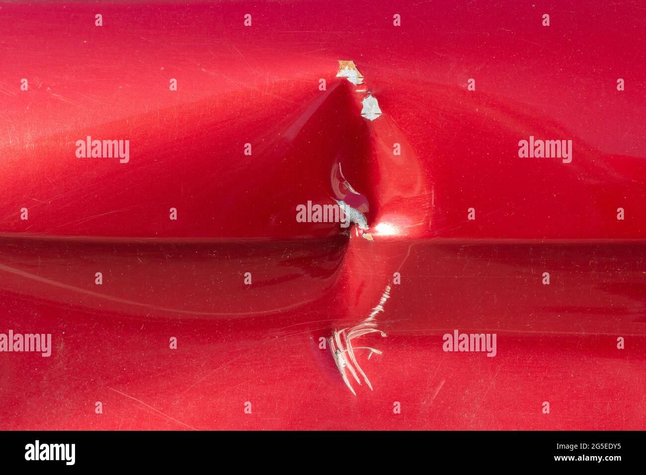 A dent in the car. The spoiled surface of the car. Spoiled painting of ...