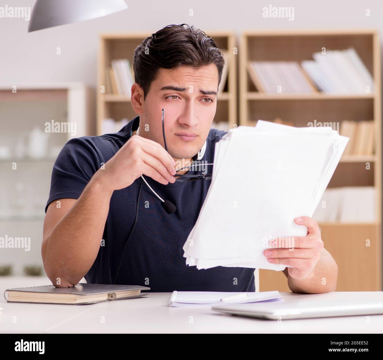 The angry man with too much paperwork to do Stock Photo - Alamy