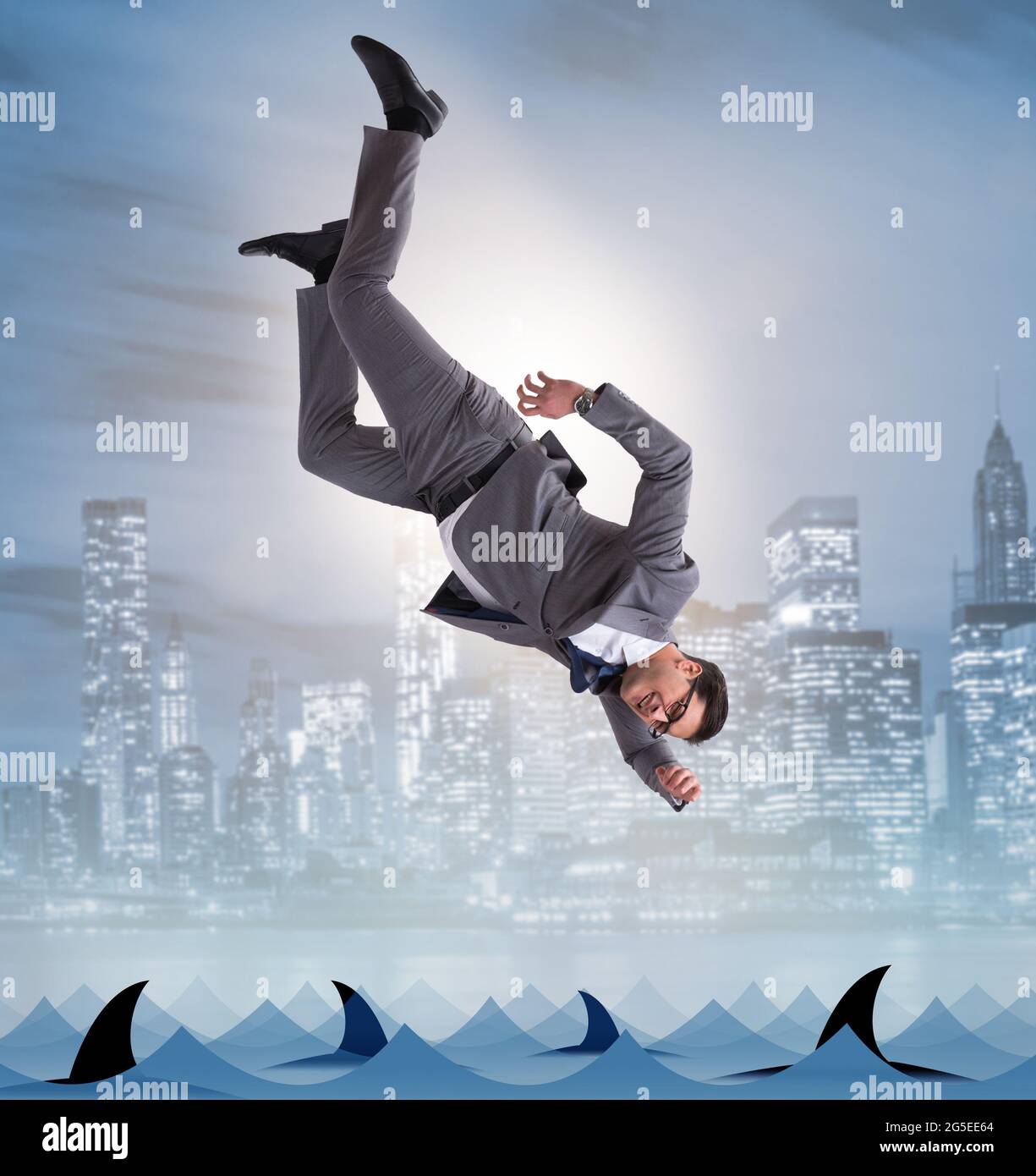 The businessman falling into sea with sharks Stock Photo - Alamy
