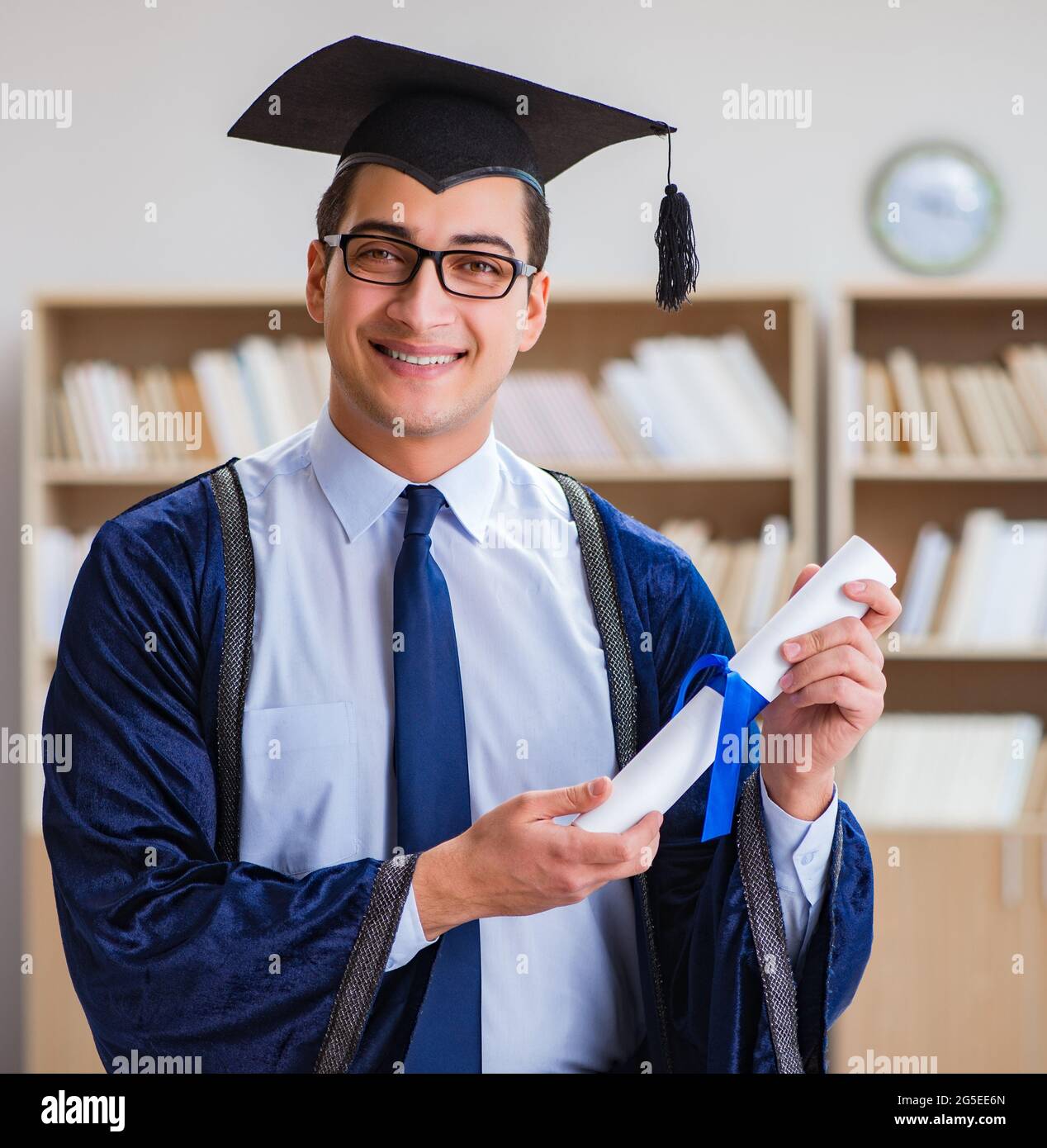 The young man graduating from university Stock Photo - Alamy