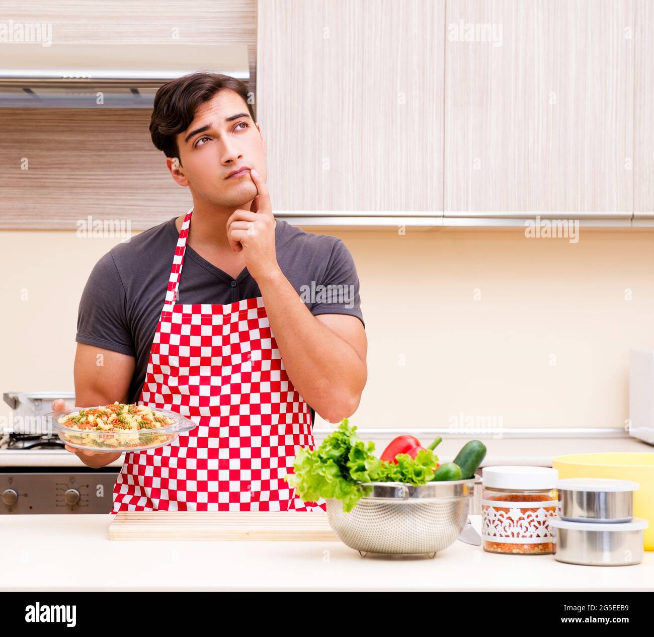 The man male cook preparing food in kitchen Stock Photo - Alamy