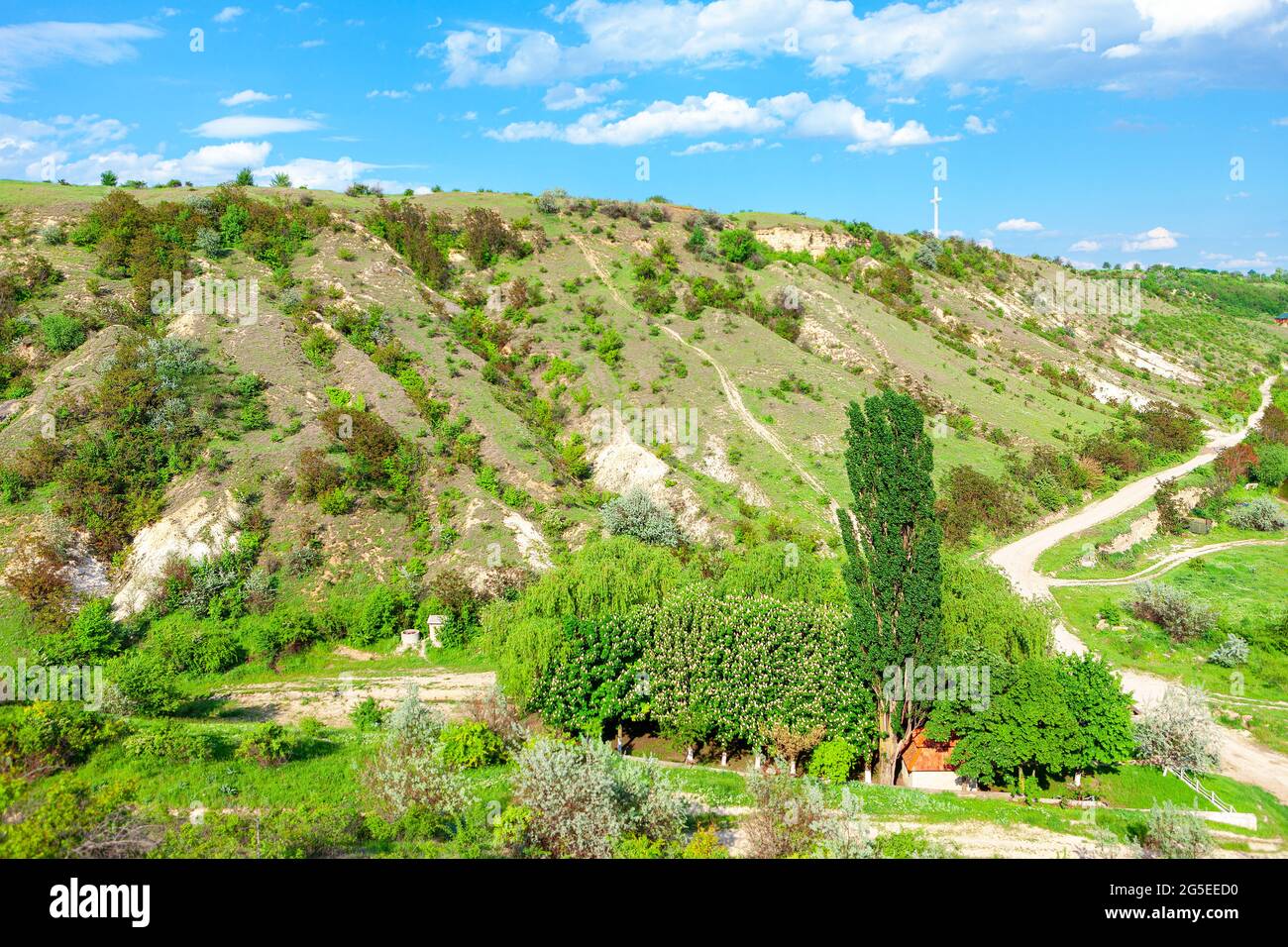 Valley and hills scenery . Cross on the hill . Landscape with country ...