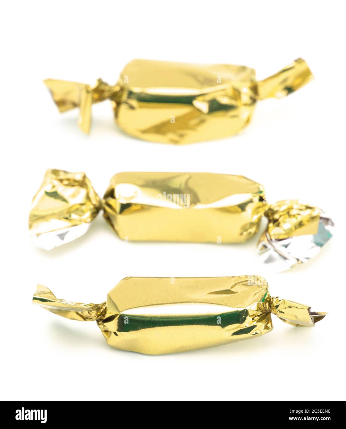 Gold wrapped sweets Cut Out Stock Images & Pictures - Alamy