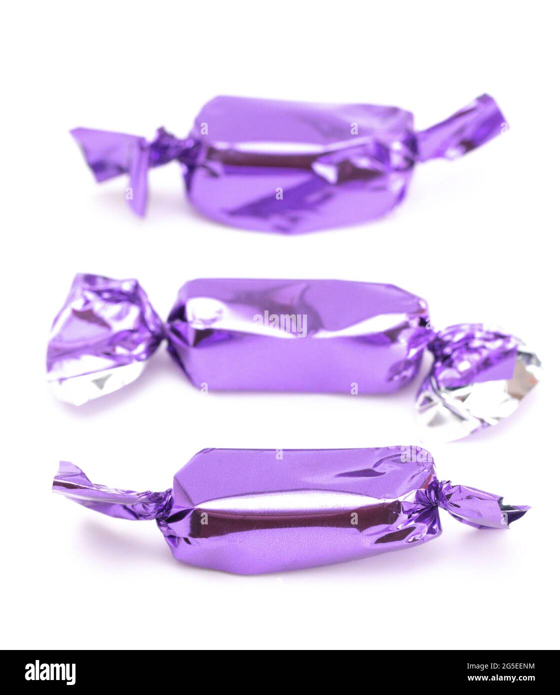 Purple Wrapped Candy on a White Background Stock Photo - Alamy