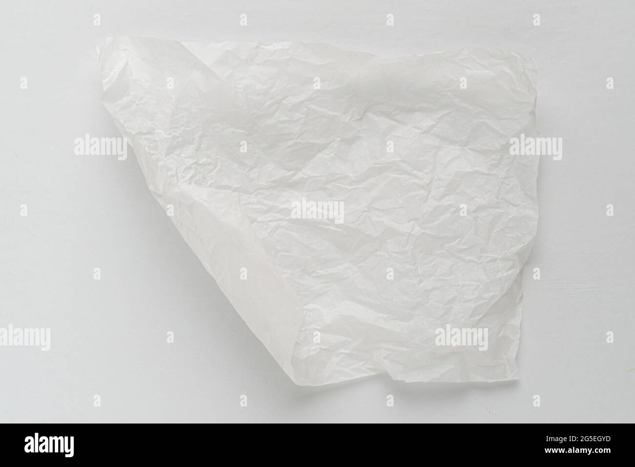 crumpled piece of cooking or baking paper on the table, mockup Stock ...
