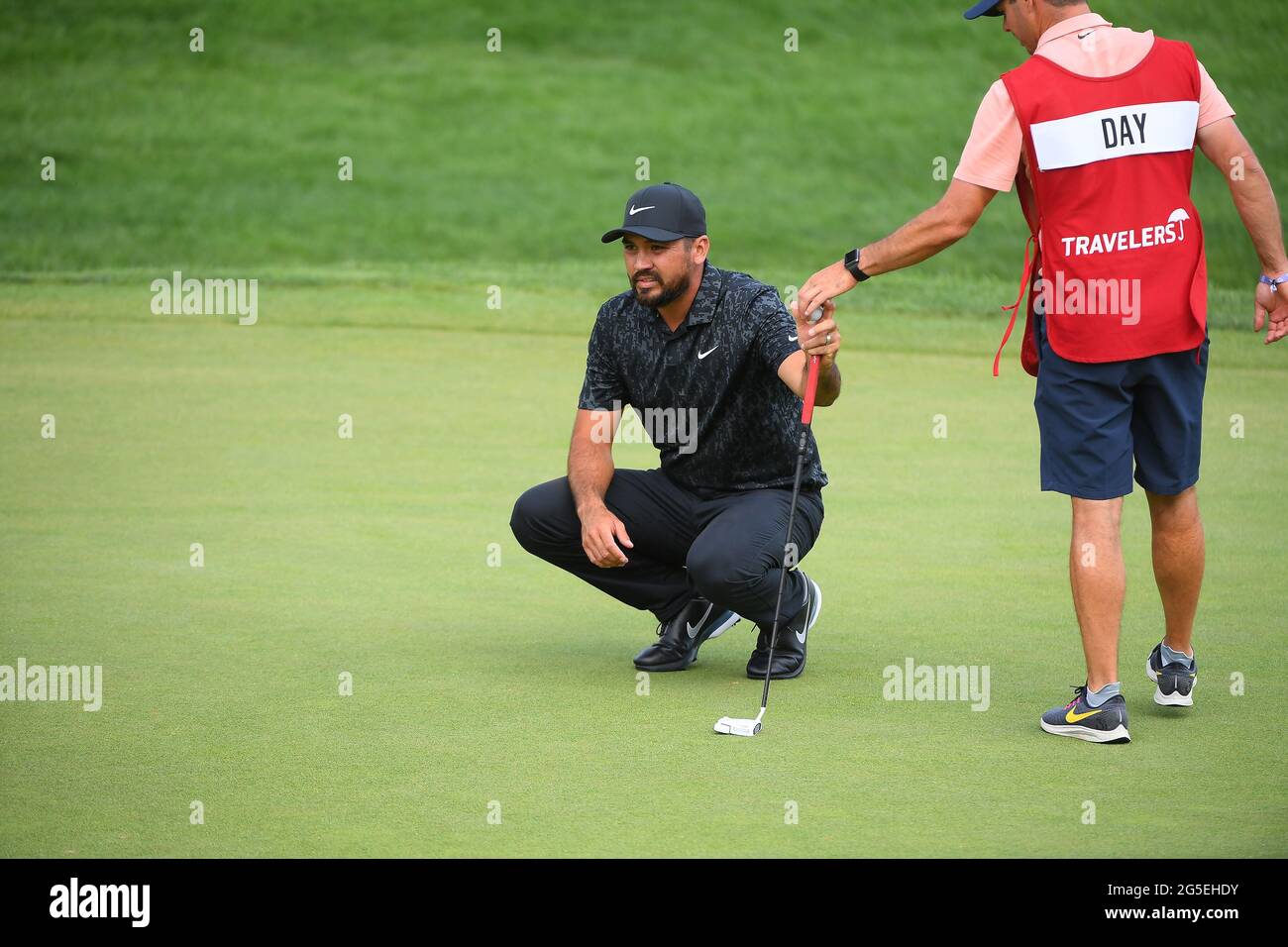 Cromwell, CT, USA. 26th June, 2021. Jason Day studies hit putt on the ...