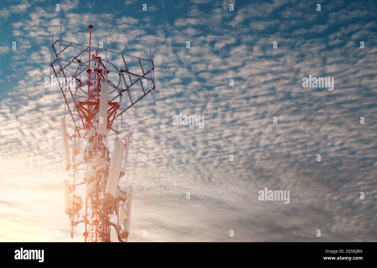 Telecommunication tower with blue sky and white clouds background ...