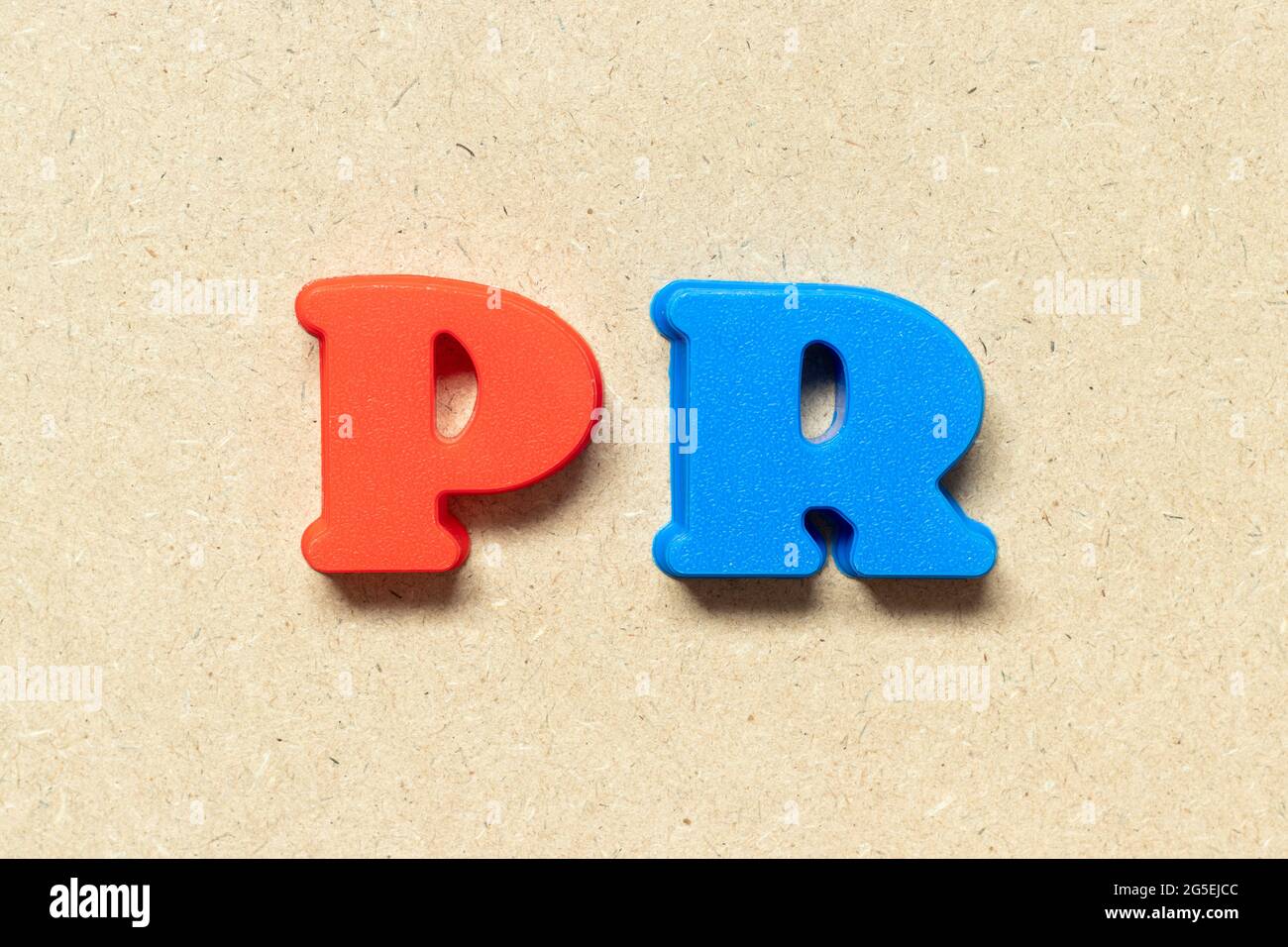 Plastic alphabet letter in word PR (Abbreviation of purchase ...