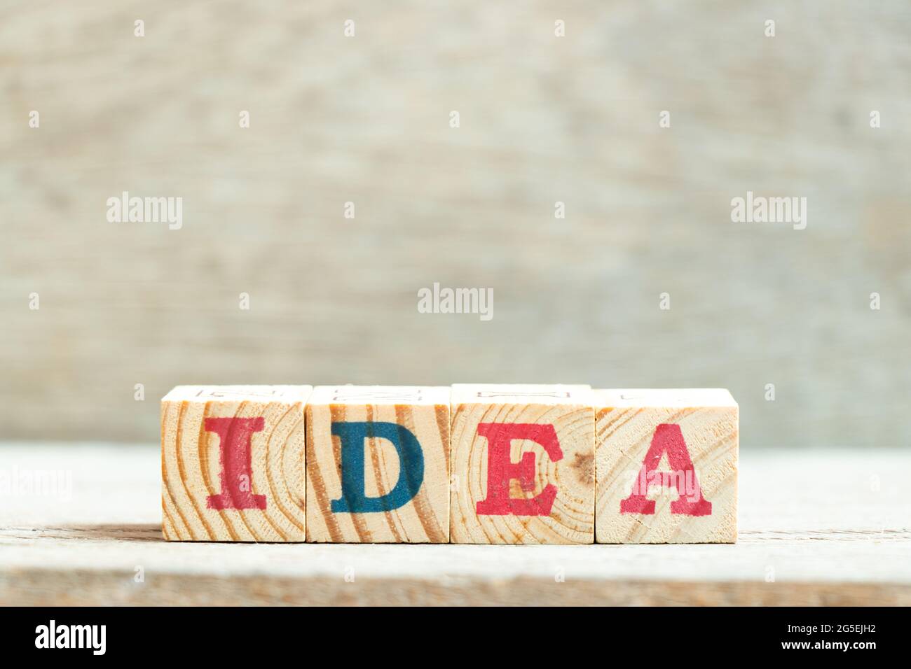 Alphabet letter block in word idea on wood background Stock Photo - Alamy
