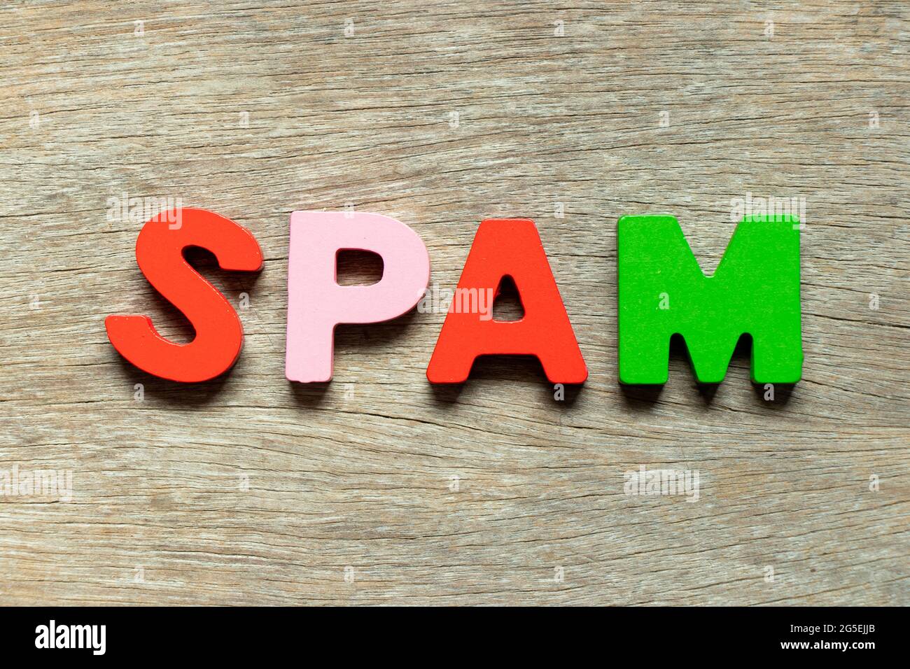 Color alphabet letter in word spam on wood background Stock Photo - Alamy