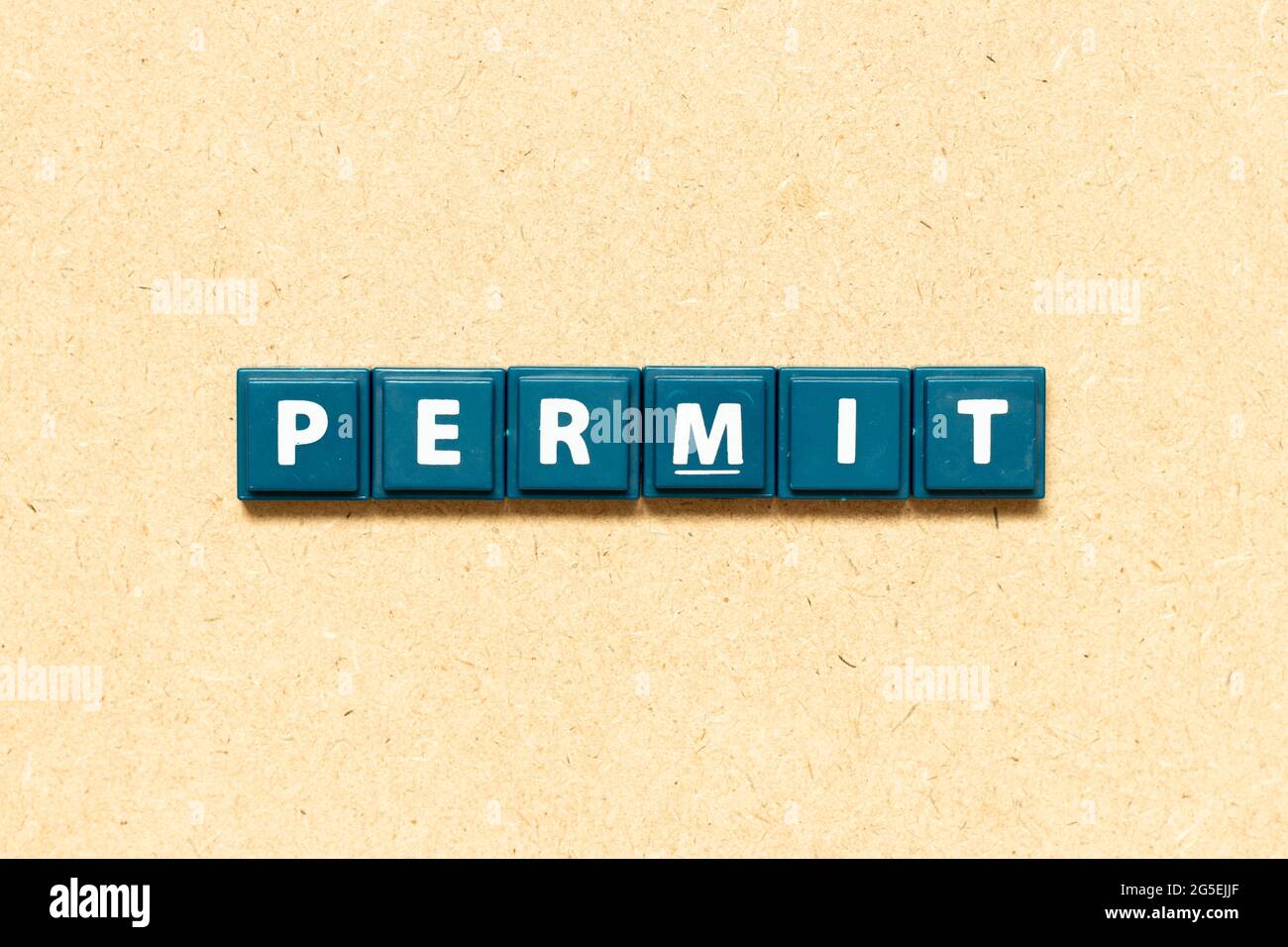 Tile alphabet letter in word permit on wood background Stock Photo - Alamy