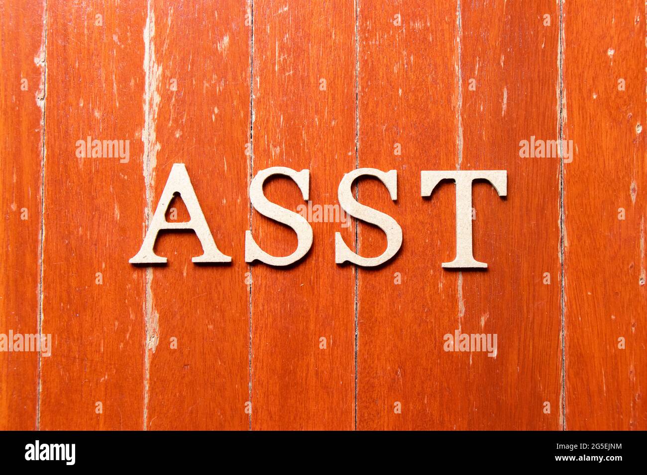 Alphabet letter in word ASST (abbreviation of assistant) on old red ...